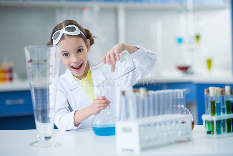 Girl Scientist in White Coat Making Experiment in Chemical Lab Stock ...