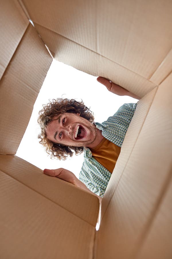 Excited Man Looking Inside Box Stock Photo - Image of gift, casual ...