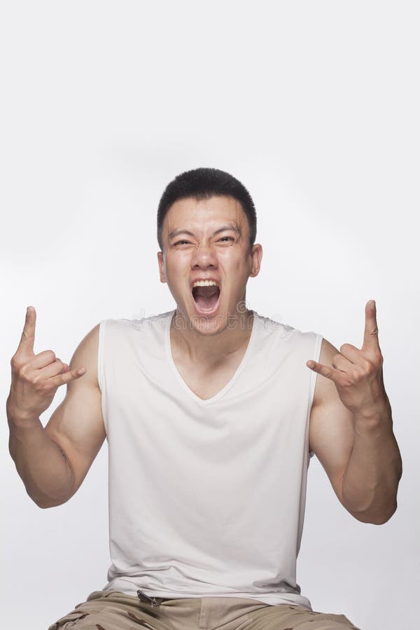 Excited Man Making Hand Sign with Mouth Open, Studio Shot Stock Image ...