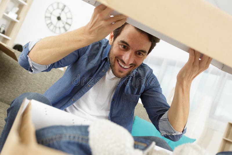 Excited man opening box stock image. Image of shipping - 200447009