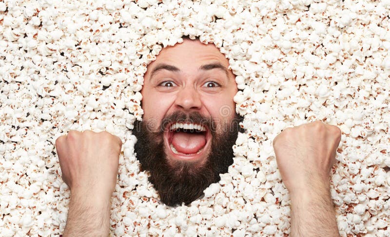 Man gesturing in popcorn stock image. Image of approval - 95440855