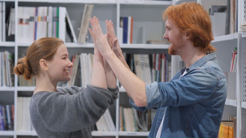 Excited Man and Woman Clapping with Eachother Stock Photo - Image of ...