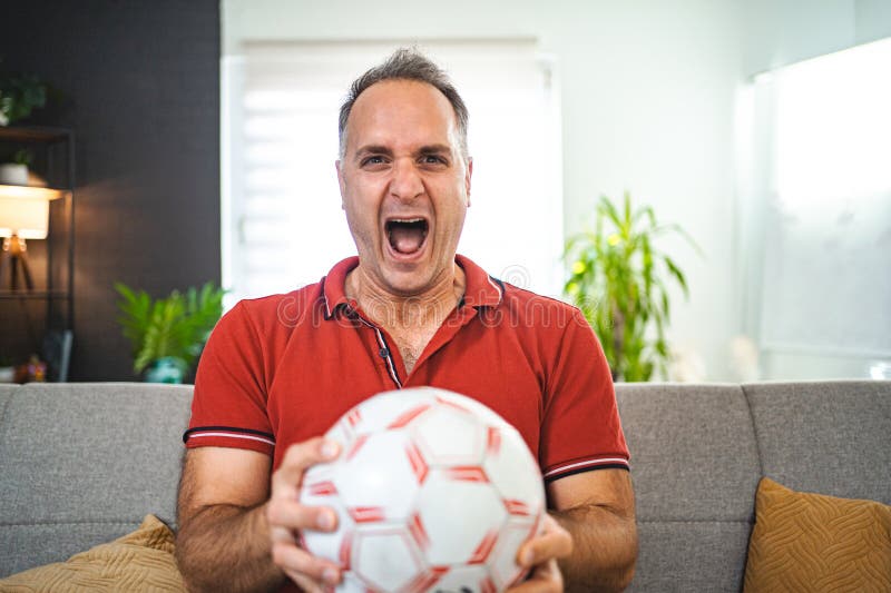 Excited Middle Aged Man Watching Soccer Game at Home Stock Image ...