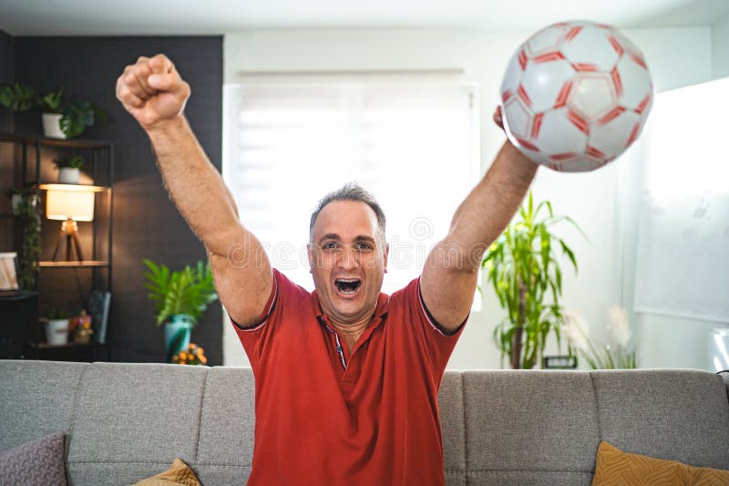 Excited Middle Aged Man Watching Soccer Game at Home Stock Photo ...