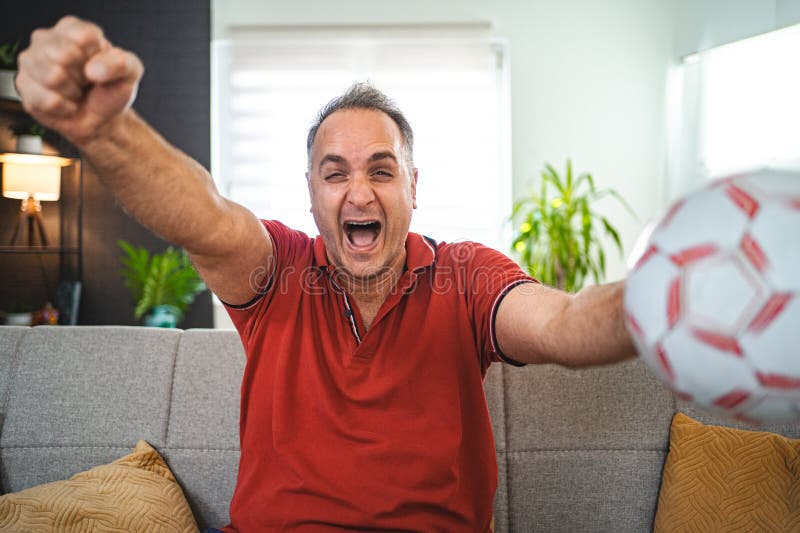 Excited Middle Aged Man Watching Soccer Game at Home Stock Image ...