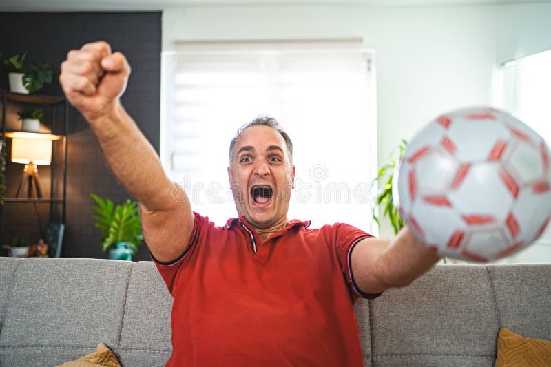 Excited Middle Aged Man Watching Soccer Game at Home Stock Image ...