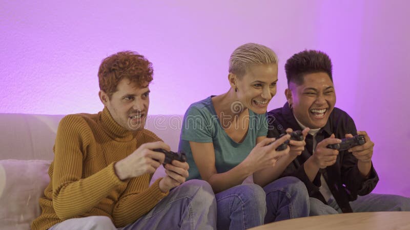Excited Multiethnic Friends Playing Console at Home Stock Image - Image ...