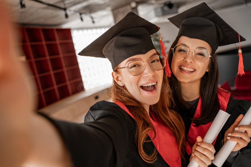 Excited and Pretty Students Holding Diploma Stock Photo - Image of ...