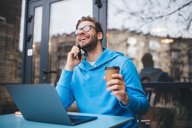 Excited Programmer Discussing Software Developing while Calling and ...