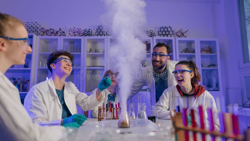Excited Science Students with Teacher Doing Chemical Experiment in the ...