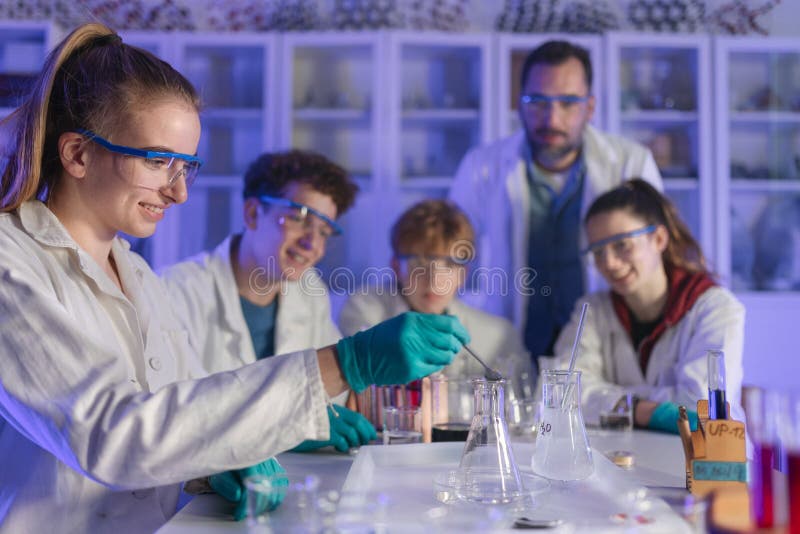 Excited Science Students with Teacher Doing Chemical Experiment in the ...