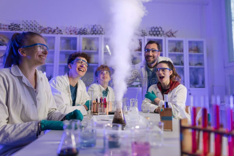 Excited Science Students with Teacher Doing Chemical Experiment in the ...