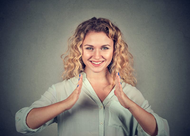 Excited Smiling Young Woman Showing Big Object with Hands on Empty ...