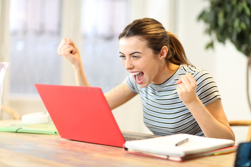 Excited Student Checking Laptop Content Stock Image - Image of approved ...