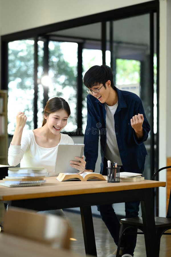 Two Cheerful College Students Celebrating Success Together. Friendship ...