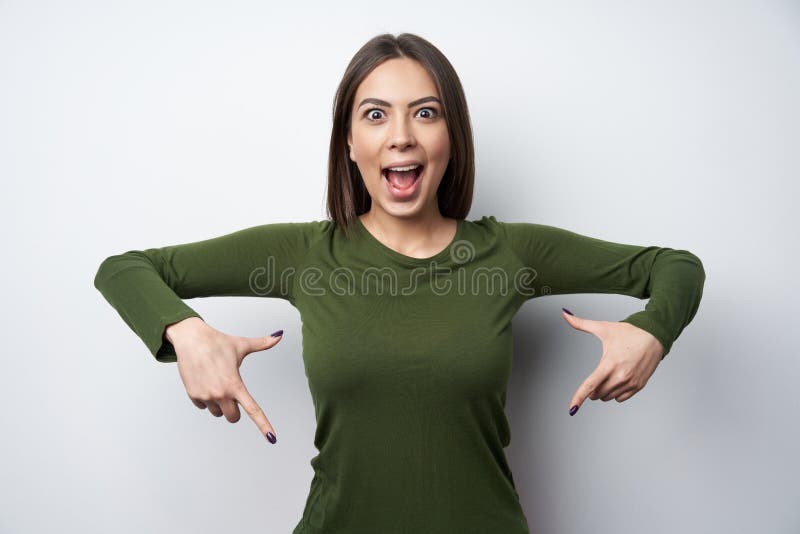 Excited Woman Pointing Down with Two Fingers Stock Photo - Image of ...