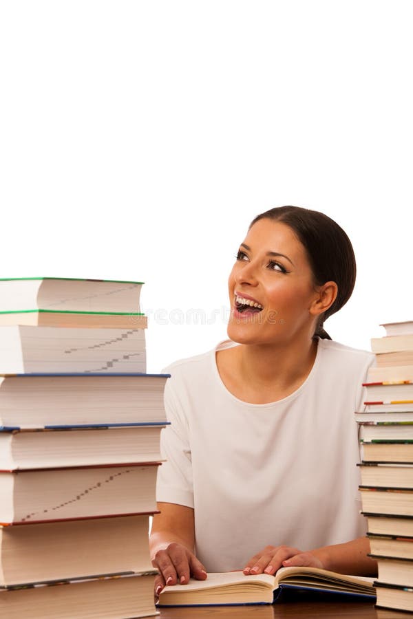 Excited Woman Reading Behind the Table between Two Pile of Books Stock ...