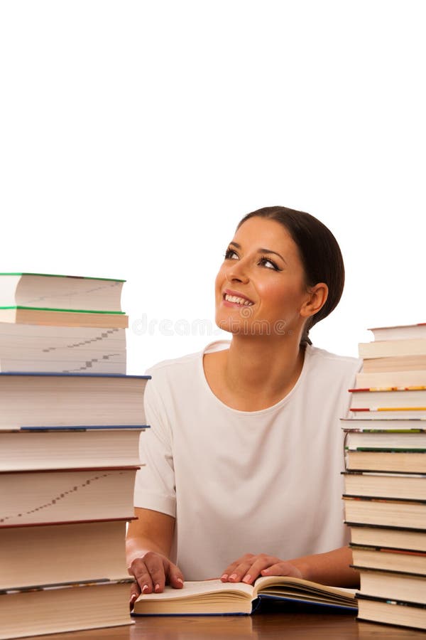 Excited Woman Reading Behind the Table between Two Pile of Books Stock ...