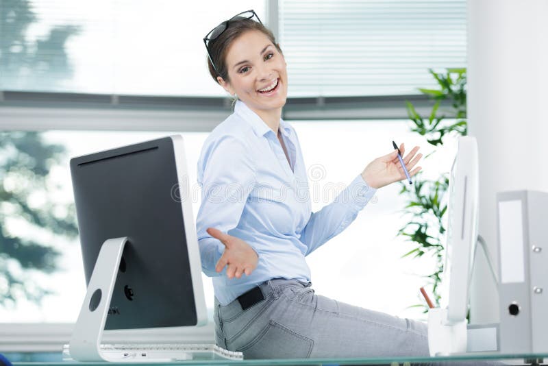 Excited Woman Working at Desk in Office Stock Image - Image of working ...