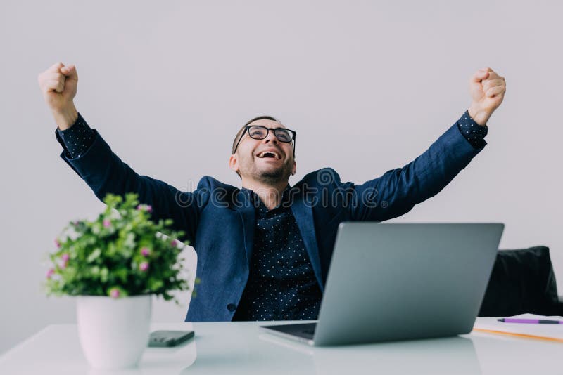 Excited Worker Sitting at Desk in Coworking Space Use Computer Reading ...