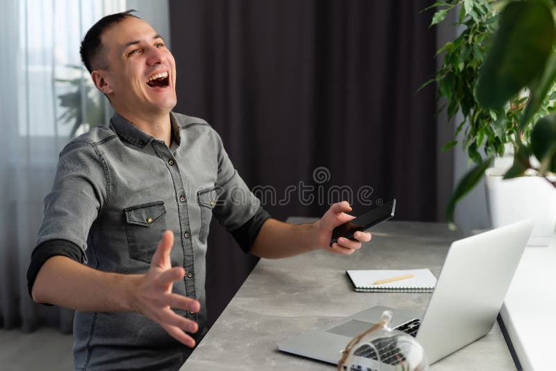 Excited Worker Sitting at Desk in Coworking Space Use Computer Reading ...