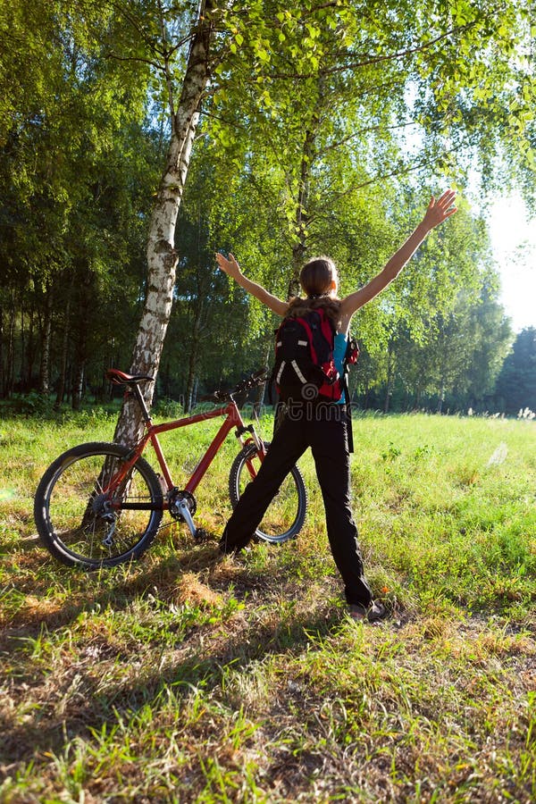 Excited Young Cyclist Standing in a Spring Park Stock Photo - Image of ...