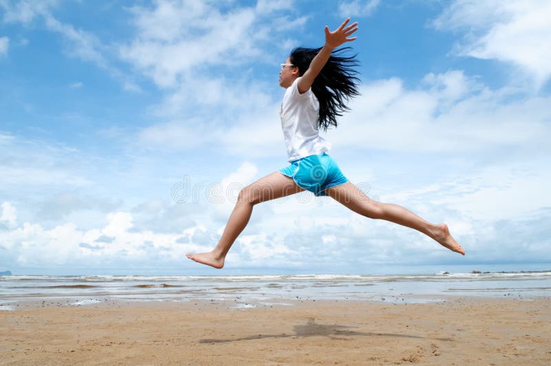 Excited Young Girl Leaping in the Air Stock Photo - Image of enjoyment ...