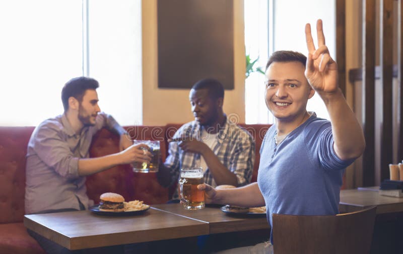 Excited Young Guy Ordering More Beer, Resting with Friends at Bar Stock ...