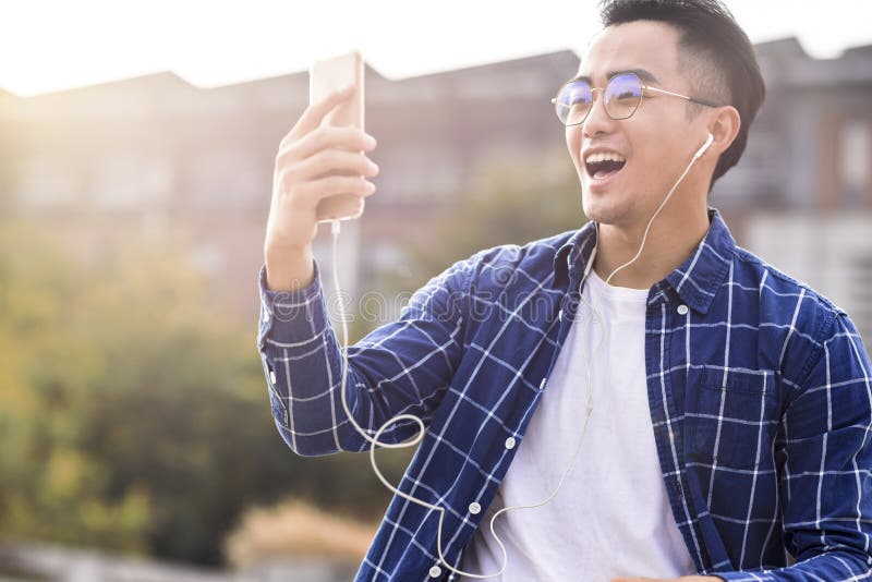 Excited Young Man Watching the Mobile Phone Stock Photo - Image of ...
