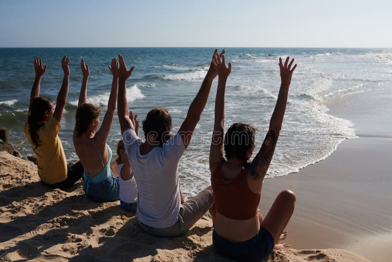 Excited Young People on Beach Stock Photo - Image of group, sunset ...