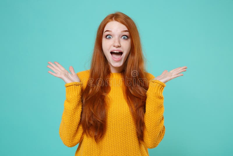 Excited Young Redhead Woman Girl In Yellow Sweater Posing Isolated On