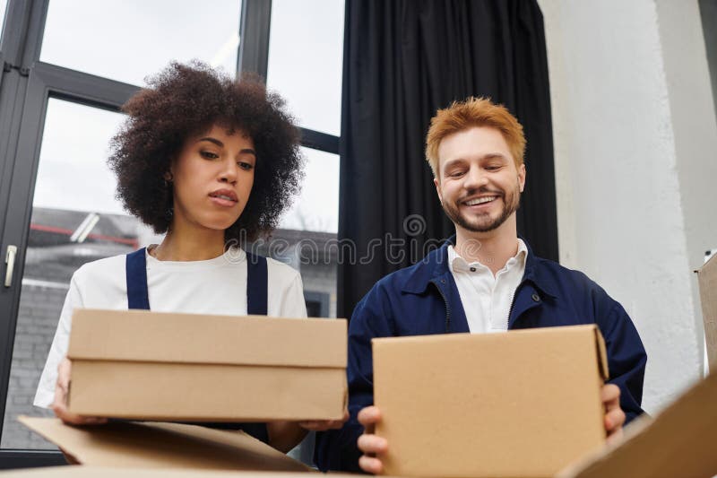Excitement and Teamwork in Packing and Stock Photo - Image of cheerful ...