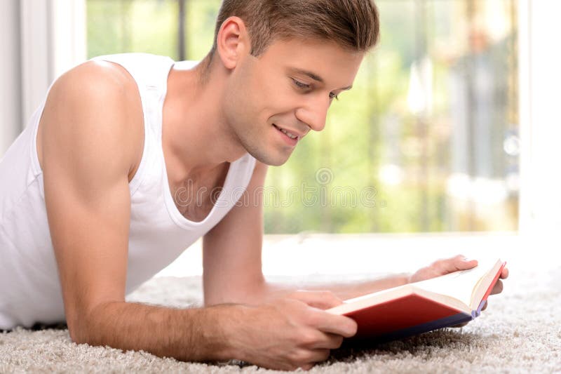 Exciting Book. Side View of Handsome Young Men Reading a Book W Stock ...