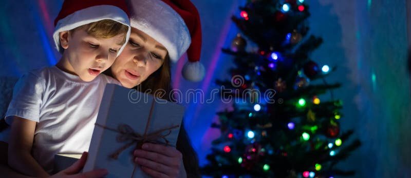 Exciting Mom and Son Open a Glowing Gift Box at a Magical Christmas ...