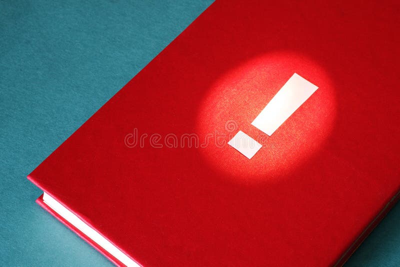 An Exclamation Point Cut Out of Paper is on the Red Book Stock Photo ...