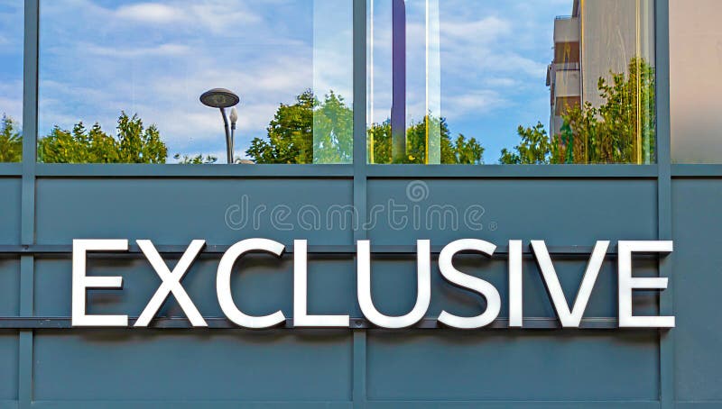 Exclusive Sign on a Building Facade Stock Photo - Image of sign, street ...