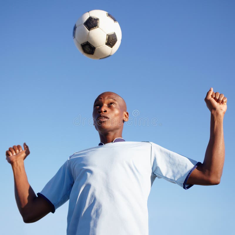 Executing a Perfect Defensive Header. a Young Man Going Up for a Header ...