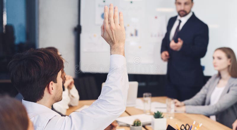 Executive Asking Question To Speaker at Presentation Stock Photo ...