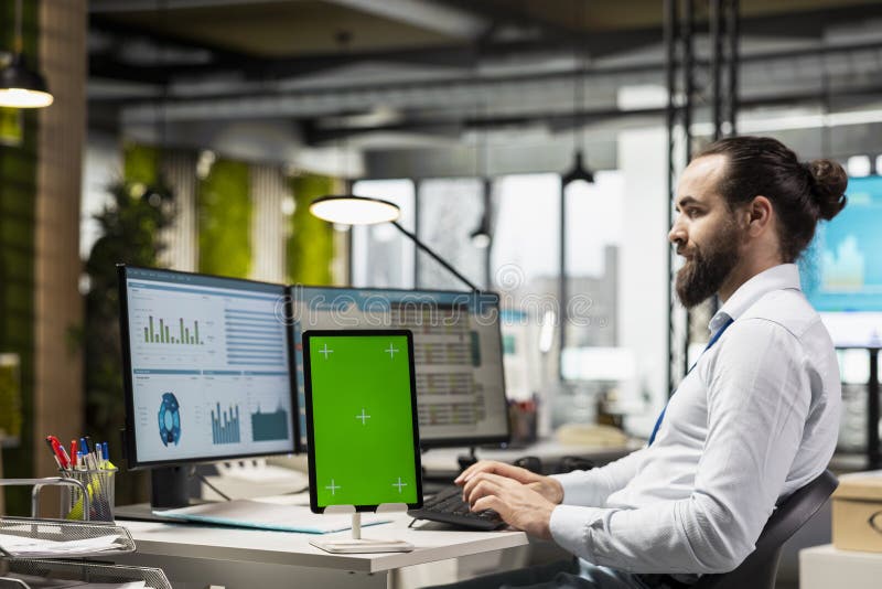 Executive Assistant Analyzing KPI Metrics on Pc Next To Tablet with ...