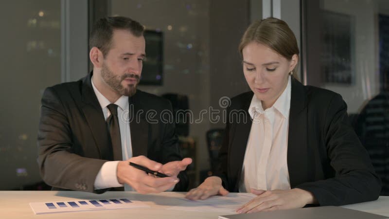The Executive Business People Having Arguments on Documents at Night ...
