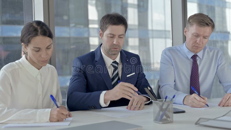 Executive Business People Doing Conversation on Documents in Boardroom ...