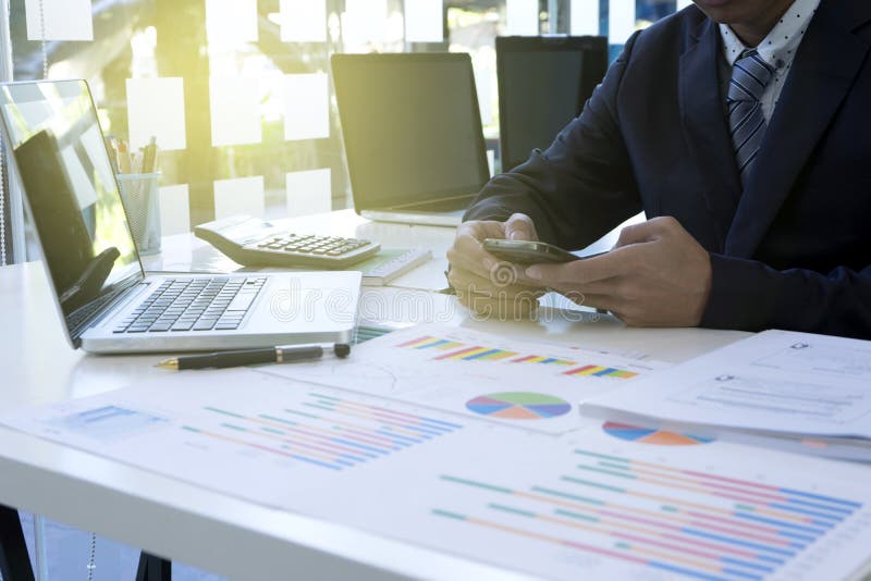 Female Chief Executive Sitting at Her Desk Taking Notes in Datebook ...