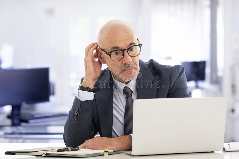 Executive Businessman Sitting at the Office and Using Computer for Work ...