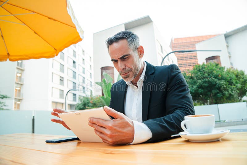 Executive Businessman Using Tablet at Outdoor Cafe Successful Middle ...