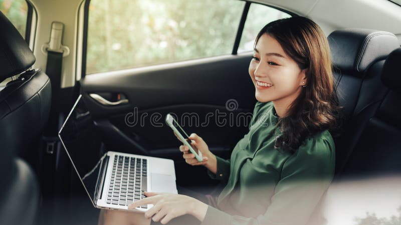 Executive Businesswoman in Car Work on Her Laptop Stock Photo - Image ...
