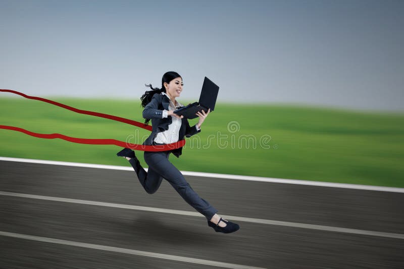 Executive Businesswoman Running and Holding Laptop Stock Image - Image ...