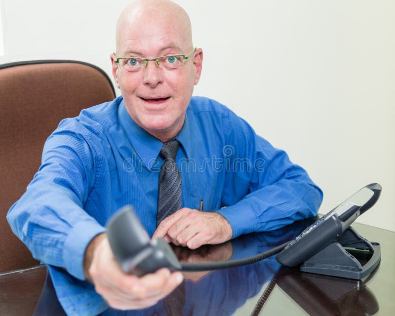 Executive at Desk Handing Over Phone Stock Photo - Image of giving ...