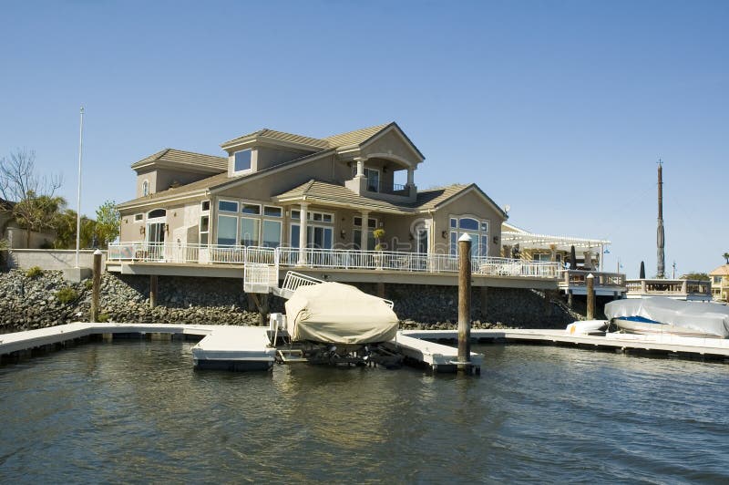 Waterfront House Pool, Boats, Jet Skis Stock Photo - Image of million ...