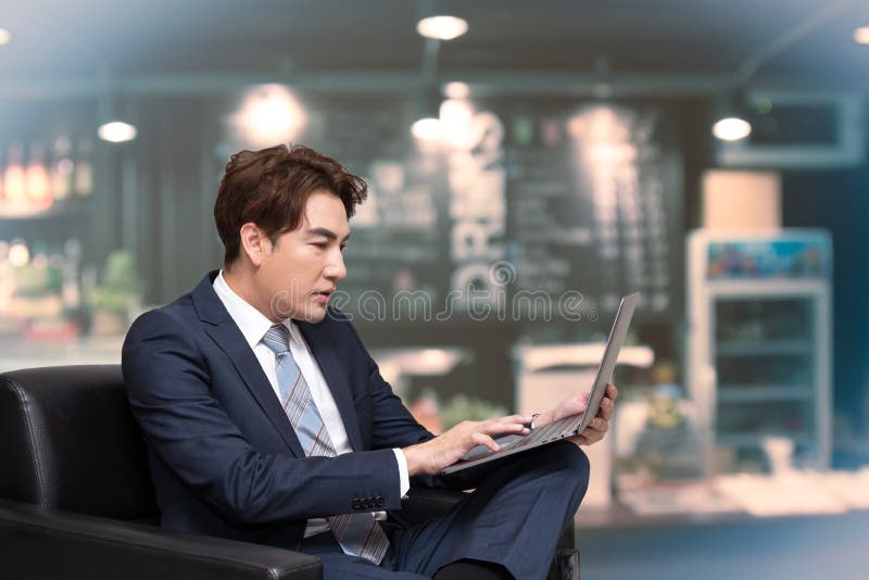 Executive Manager Check Information from Laptop while during Sitting in ...