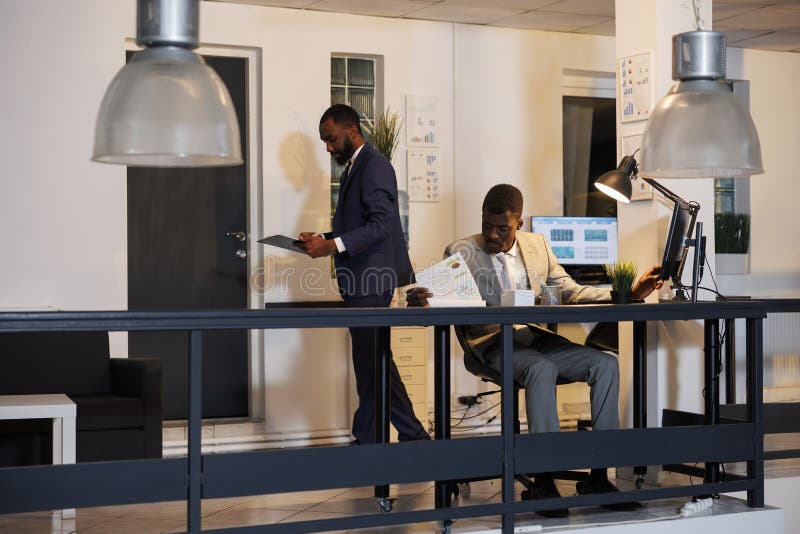 Executive Manager Sitting at Desk in Startup Office Stock Photo - Image ... Executive Manager Sitting at Desk in Startup Office Stock Photo - Image ...